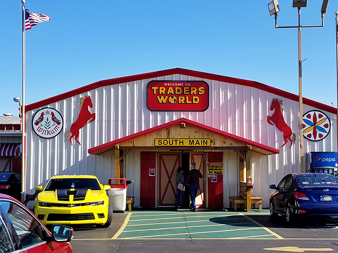 The iconic South Main entrance to Traders World, complete with its signature red horses&mdash;like sentinels guarding a treasure trove of bargains within.