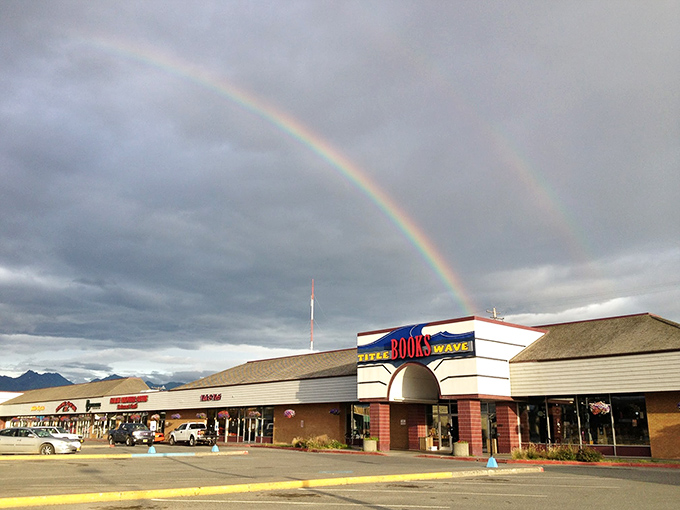 A literary pot of gold! Title Wave Books stands proudly under a double rainbow, promising treasures for book lovers of all stripes.