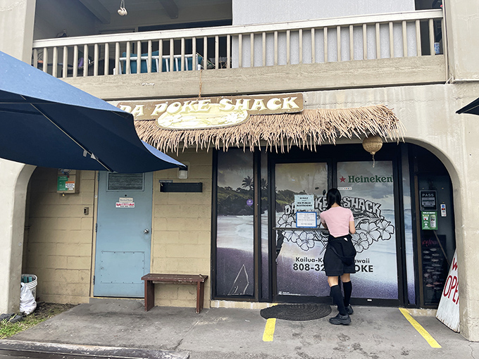 Welcome to Da Poke Shack, where the thatched roof says "tropical getaway" and the menu screams "seafood paradise"!