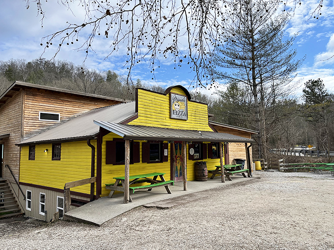 A splash of sunshine in the Kentucky woods! Miguel's Pizza stands out like a beacon of cheesy goodness, beckoning hungry adventurers with its vibrant yellow facade.