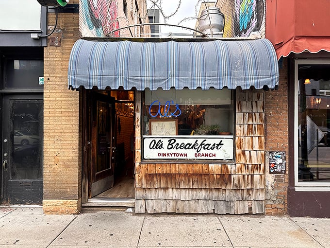 Squeeze play! Al's Breakfast, tucked between buildings like the world's tastiest bookmark, invites you to a cozy culinary adventure.