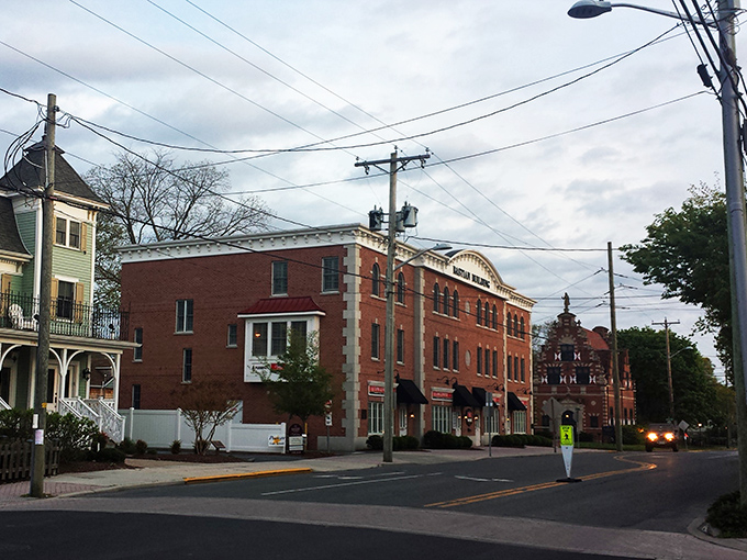 Lewes after dark: Where history meets mystery. The streetlights cast a warm glow on brick buildings, inviting you to explore the town's secrets.