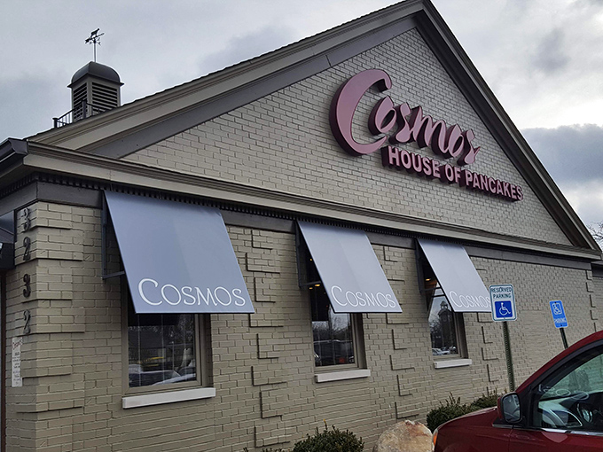 Welcome to breakfast paradise! The Breakfast Clubb's charming exterior promises a feast for the senses, with its inviting awnings and cozy brick facade.