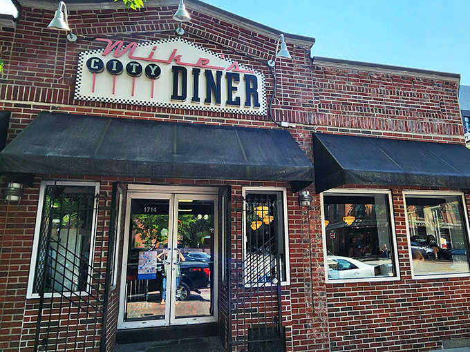 A restaurant sign that could guide hungry sailors home! Mike's City Diner stands proud, its brick facade a beacon of comfort food in Boston's South End.