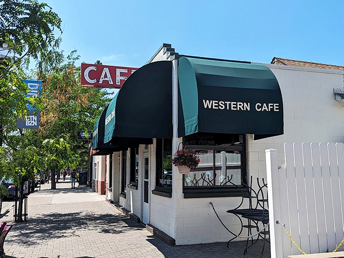 Step into a time machine disguised as a diner! The Western Caf&eacute;'s iconic green awnings and vintage signage promise a journey back to simpler times and hearty meals.