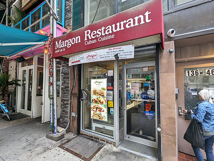 A red awning beckons like a culinary lighthouse in the urban sea. Margon's exterior promises Cuban delights just steps from the neon jungle of Times Square.