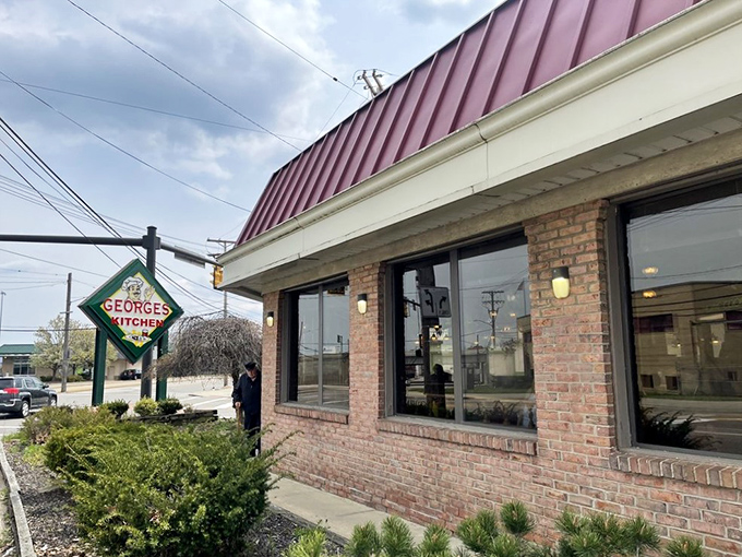 Welcome to George's Kitchen, where the neon sign is as warm as the hospitality inside. This unassuming brick facade hides a treasure trove of culinary delights that'll make your taste buds do a happy dance.