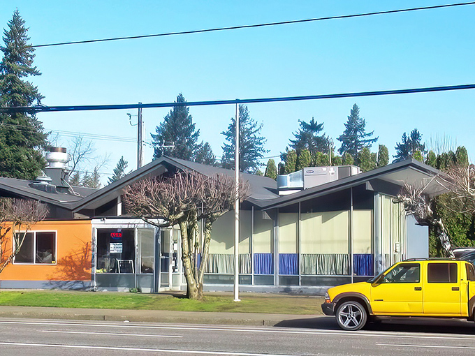 A beacon of breakfast bliss! This blue-and-white sign promises a journey into the land of fluffy pancakes and endless coffee refills.