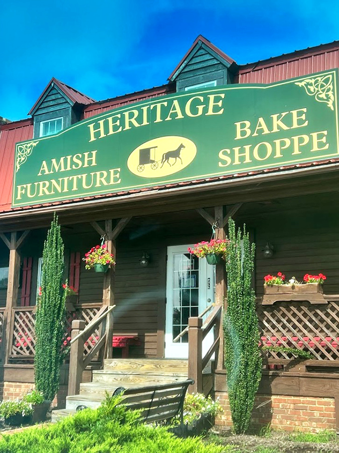 The red metal roof and welcoming wooden porch of Heritage Bake Shoppe stand as a rustic oasis amid Virginia Beach's coastal landscape.