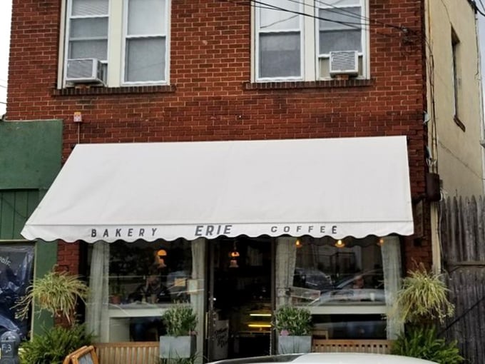 Welcome to Erie Coffeeshop & Bakery, where the awning promises coffee but the aroma whispers, "Stay for the pie!" This charming storefront could be the set of a Hallmark movie – only the treats inside are far more memorable.