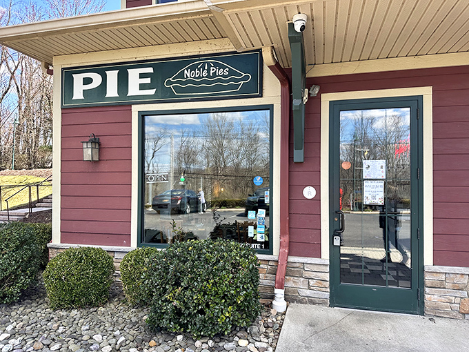A pie lover's paradise awaits! Noble Pies' charming exterior promises a slice of heaven, with its inviting red facade and playful "PIE" sign beckoning you inside.