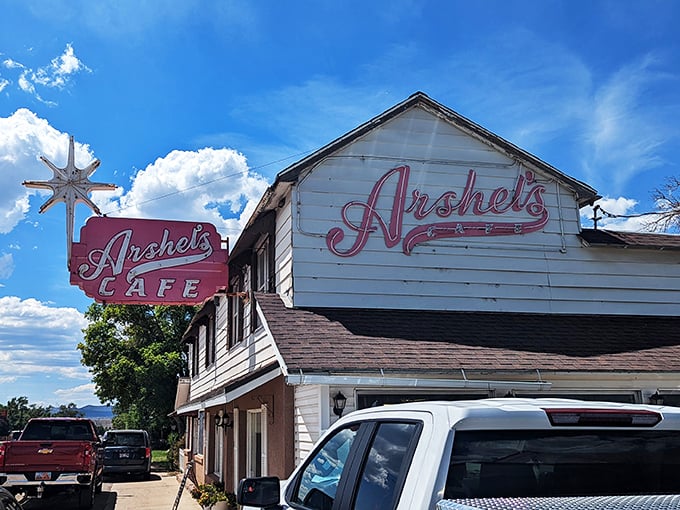 A star is born! Arshel's Cafe's iconic sign beckons road-trippers like a neon lighthouse, promising comfort food and slice-of-life experiences in equal measure.
