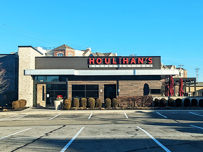 The beacon of comfort food gleams, with Houlihan's warm glow inviting hungry travelers like moths to a buttery, potato-scented flame.