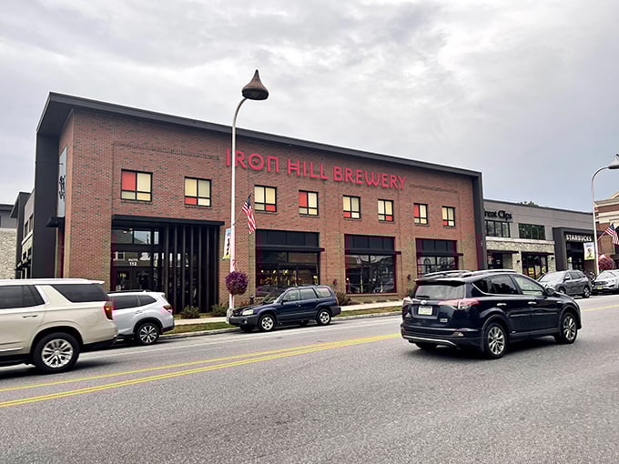 Iron Hill's brick facade glows at twilight, a beacon of craft beer and culinary promise in the heart of Hershey. Like finding an oasis after a chocolate factory tour.
