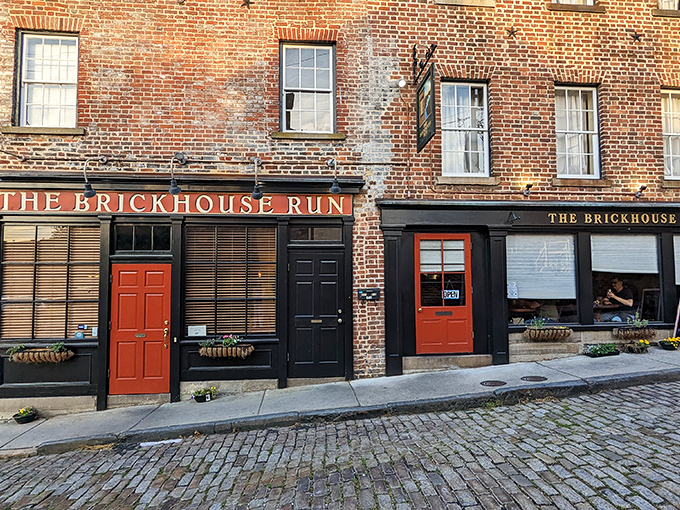 Historic charm meets culinary magic where those bright red doors practically shout, "Come in, the cobblestones have been waiting for you!"