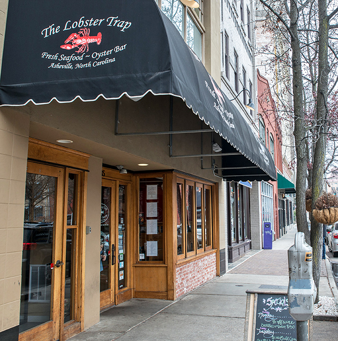 A siren song for seafood lovers! The Lobster Trap's classic black awning and bright red logo beckon you into a world where mountain meets ocean.