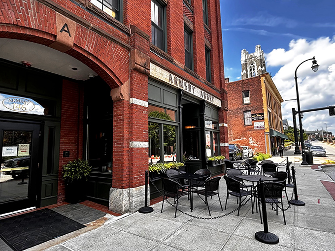 The historic brick fa&ccedil;ade of Armsby Abbey stands as Worcester's culinary beacon, its green trim and weathered sign promising gastronomic treasures within.