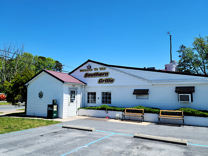 The unassuming white exterior with its bold "FOOD" flag is like a secret handshake among locals who know where real flavor lives.