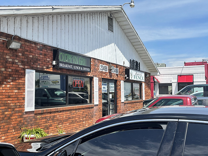 The unassuming white exterior with its bold "FOOD" flag is like a secret handshake among locals who know where real flavor lives.