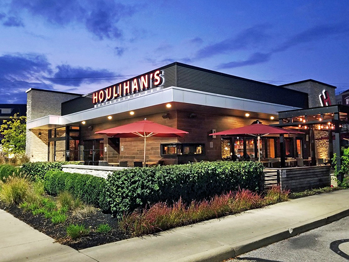 The beacon of comfort food gleams, with Houlihan's warm glow inviting hungry travelers like moths to a buttery, potato-scented flame.