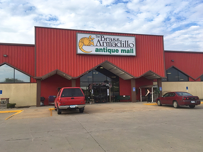 Welcome to the Brass Armadillo, where time travel is just a step through these red doors! This antique mall is like a giant, friendly barn filled with treasures.
