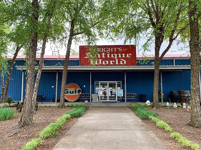 A blue oasis of nostalgia beckons! Bright's Antique World stands tall, its vintage Gulf sign a beacon for treasure hunters and time travelers alike.