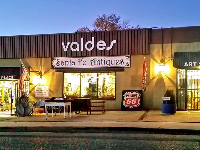 Welcome to Santa Fe Antiques, where time travel is just a doorway away. Step into this olive-green time machine and prepare for a journey through decades of treasures.