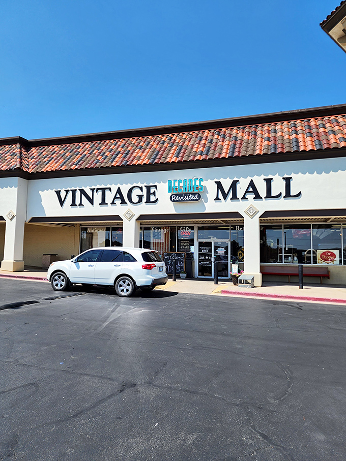 Welcome to the time machine! Decades Revisited's exterior promises a journey through the ages, with its Spanish-style roof and clock tower standing sentinel over vintage treasures.