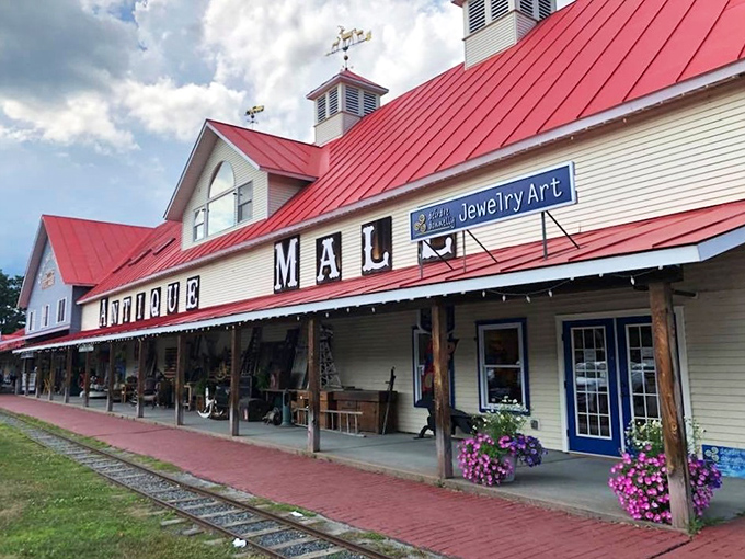 The iconic exterior of Vermont Antique Mall stands like a beacon of nostalgia against the Green Mountain backdrop, welcoming treasure hunters from near and far.