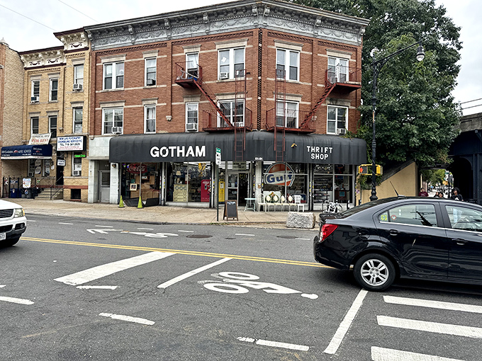 A brick-and-mortar time machine! Gotham Thrift Shop's classic facade promises adventures in vintage treasures, with a side of street art flair.