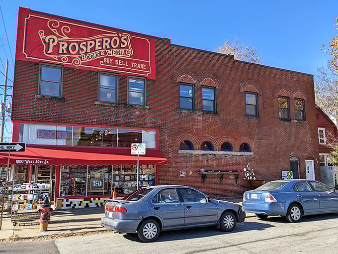 A literary beacon in brick and mortar! Prospero's Books stands tall, its vibrant red sign a siren call to bibliophiles and curious souls alike.