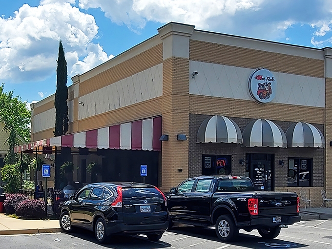 Step back in time! This retro diner's facade promises a journey to the golden age of rock 'n' roll and mouthwatering milkshakes.