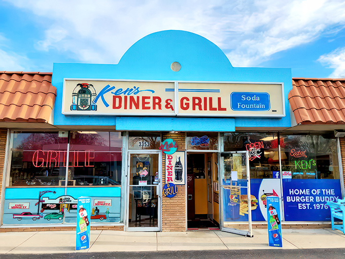 Step into a time warp! Ken's Diner & Grill's exterior is a neon-lit beacon of nostalgia, promising comfort food and a hefty dose of 1950s charm.