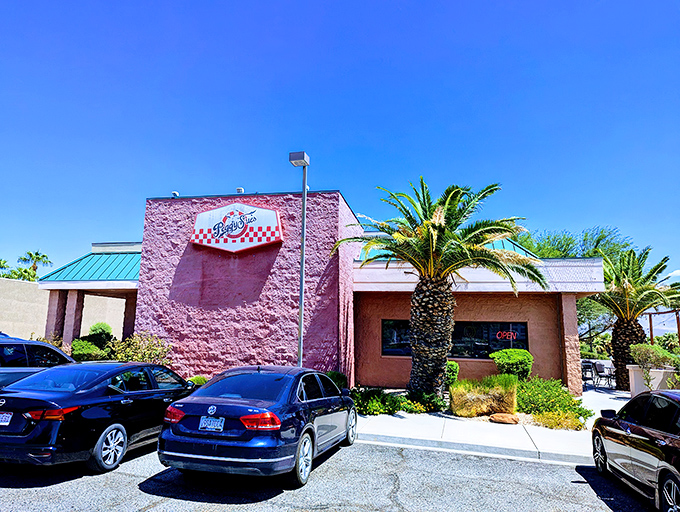 Welcome to Peggy Sue's, where the past is always present! This pink paradise stands out against the Nevada sky like a retro oasis, beckoning you to step back in time.