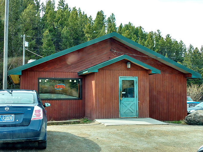 A rustic wooden haven nestled among towering pines, this unassuming cafe proves that big flavors come in small packages.