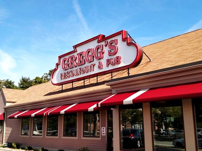 Welcome to flavor town! Gregg's iconic sign promises a feast for the senses, with its retro charm and bold red awnings beckoning hungry patrons like a culinary lighthouse.