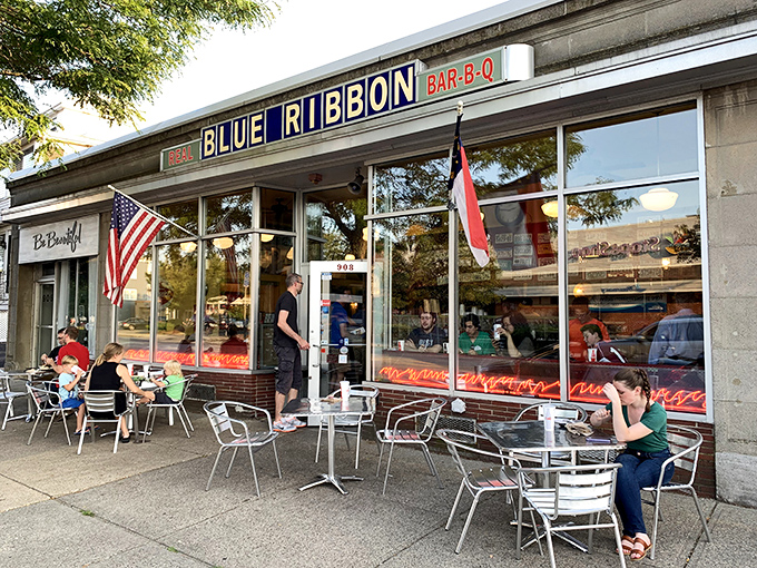 A beacon of barbecue bliss! Blue Ribbon's storefront promises smoky delights, with outdoor seating perfect for savoring summer and sauce-stained fingers.