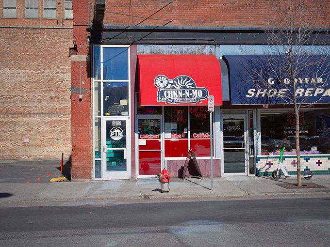 Welcome to flavor town! This vibrant red awning is like a beacon for barbecue lovers, promising Southern-style cookin' that'll make your taste buds dance. 