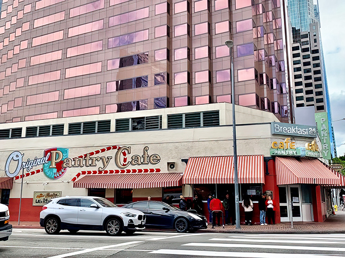 The iconic red and white exterior stands like a time capsule amid downtown LA's skyscrapers&mdash;a defiant reminder that some traditions are worth preserving.