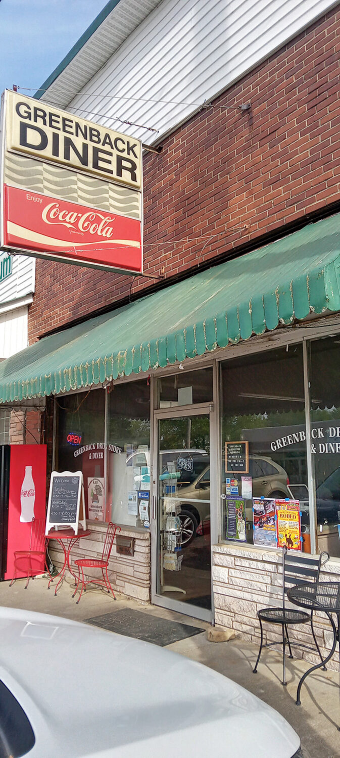 The classic brick exterior with its vintage Coca-Cola sign and green awning isn't trying to be retro-cool&mdash;it's the real deal, standing proudly since 1933.