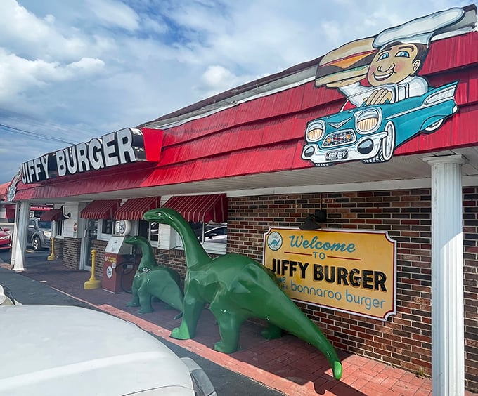 Welcome to burger paradise! Jiffy Burger's retro exterior promises a trip back in time, complete with friendly dinosaurs guarding the entrance.