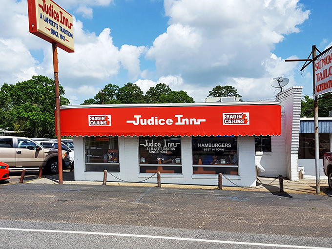 A beacon of burger bliss! Judice Inn's iconic red awning and retro sign promise a journey back to simpler, tastier times.