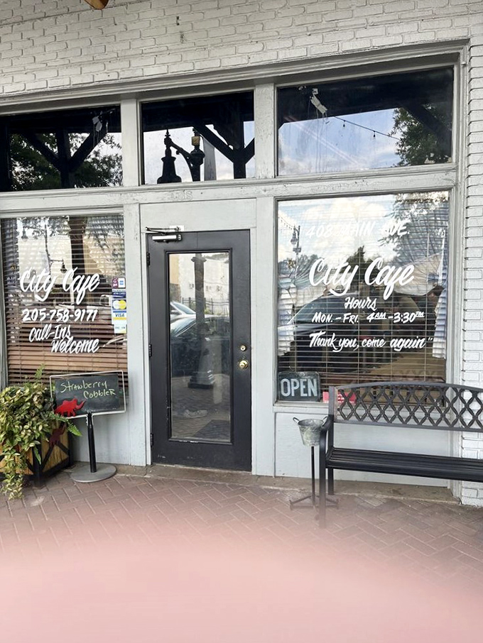 Step into a time machine disguised as a diner! City Cafe's weathered sign promises a journey back to simpler times and hearty meals.