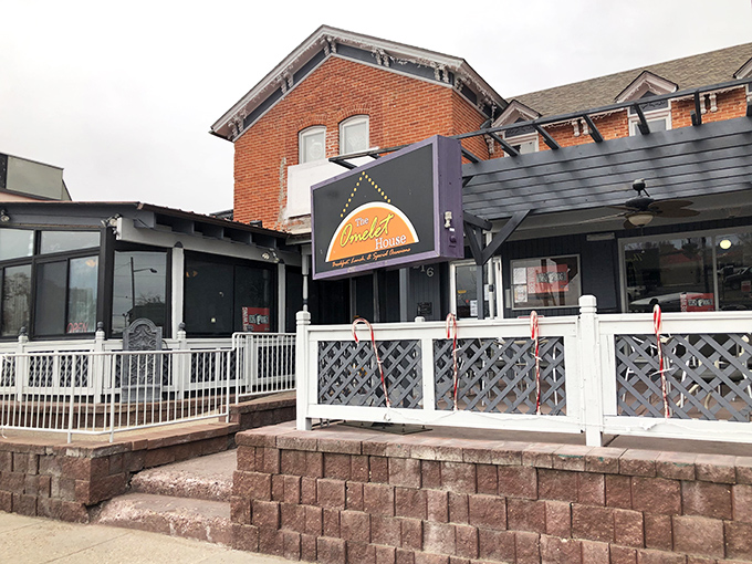 A brick-and-mortar love letter to breakfast! The Omelet House stands proud, its sign a beacon of hope for the hungry and hung-over alike.