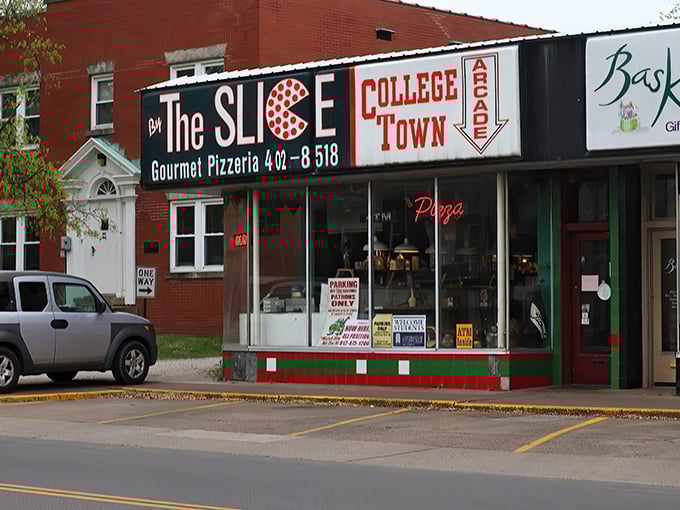 Welcome to pizza paradise! This retro-chic storefront is like a time machine that transports you straight to flavor town. 