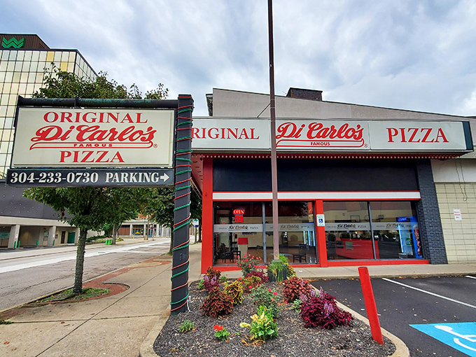 A slice of Americana! DiCarlo's iconic red and white storefront beckons pizza lovers like a siren song for the taste buds.