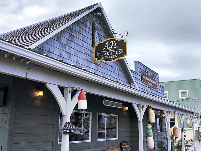 A rustic charm that's more inviting than a warm blanket on a chilly Alaskan night. AJ's OldTown Steakhouse beckons with its cozy wooden exterior and promise of meaty delights within.