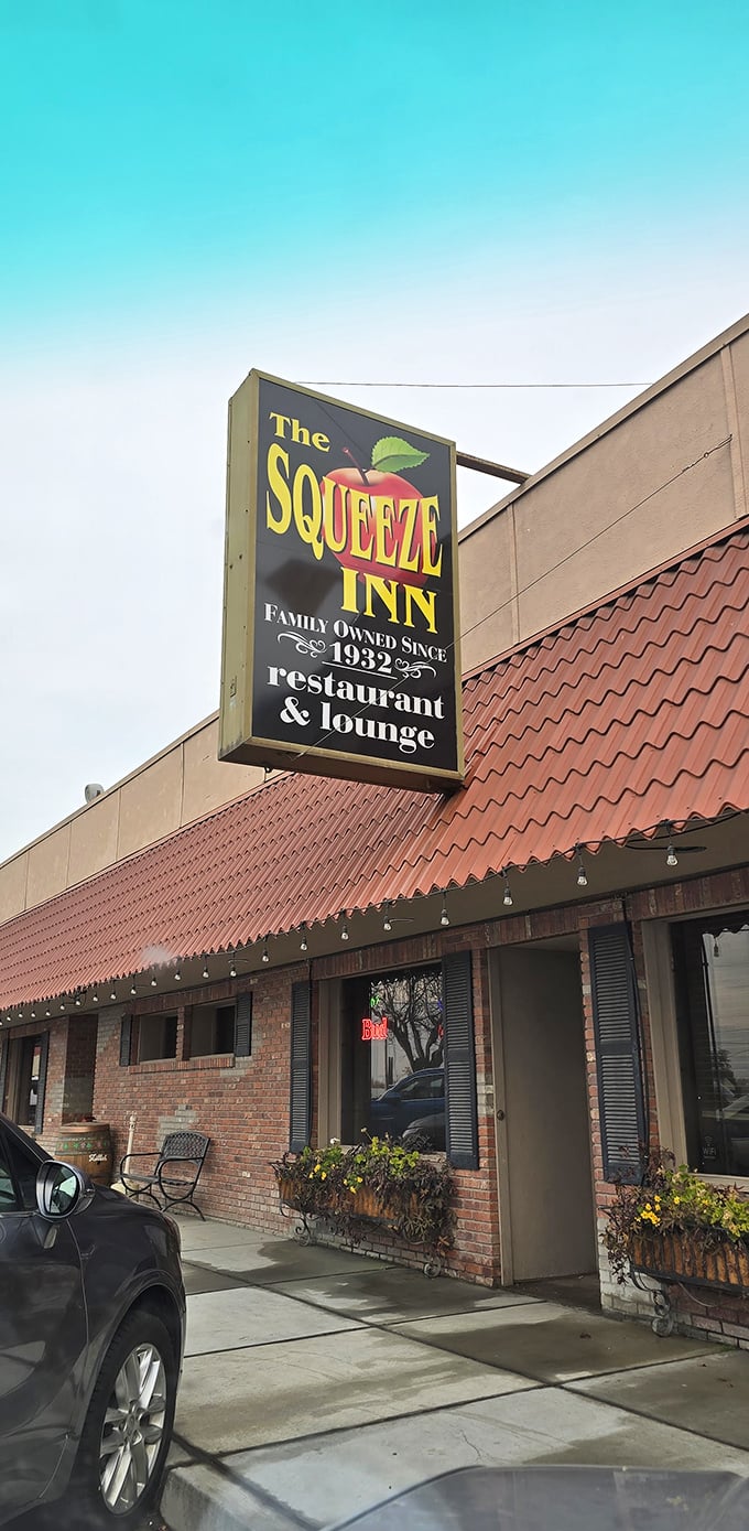 The Squeeze Inn: Where time-honored tradition meets mouthwatering steaks. This unassuming exterior hides a world of flavor waiting to be discovered.