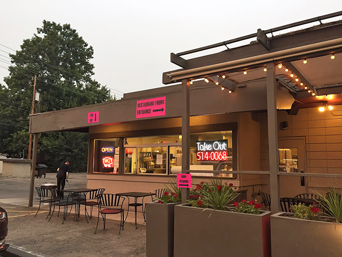 Don't judge this BBQ book by its cover! Behind that unassuming exterior and those bright pink signs lies a smoky paradise worth every carnivorous mile. 