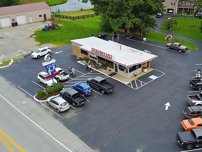 The classic roadside silhouette of Little Town & Country Restaurant stands as a beacon of hope for hungry travelers and breakfast enthusiasts alike.